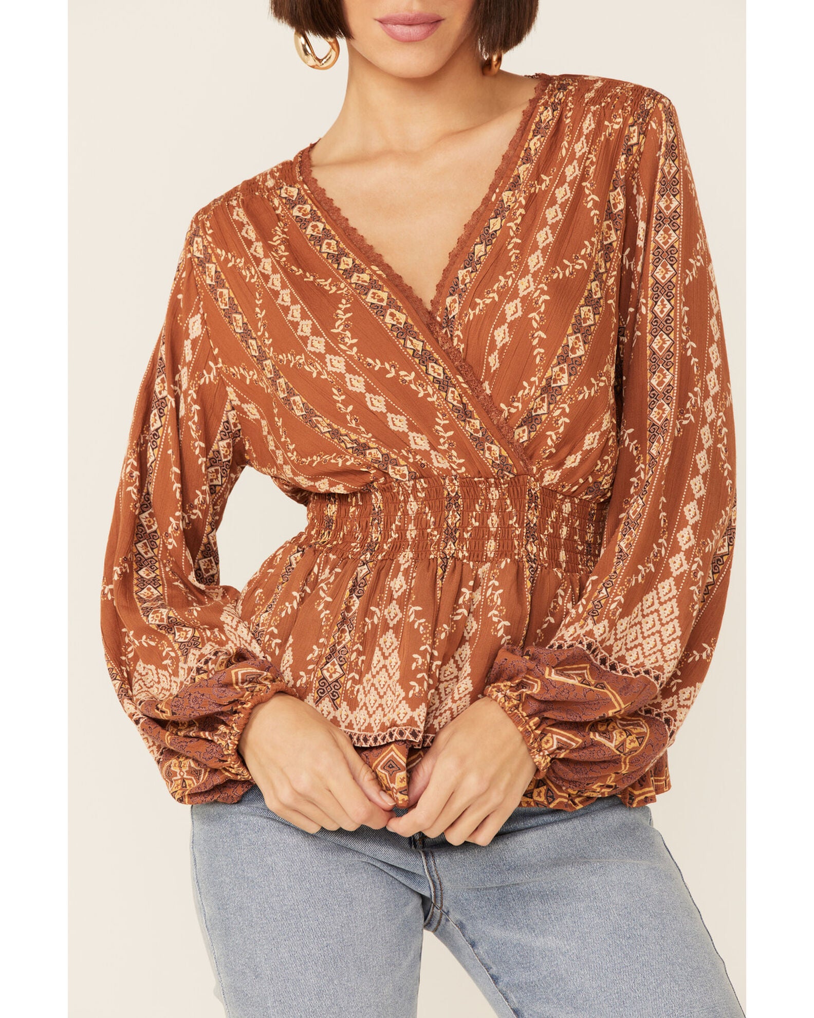 Product Name: Angie Women's Rust Border Print Surplice Peplum Woven Top