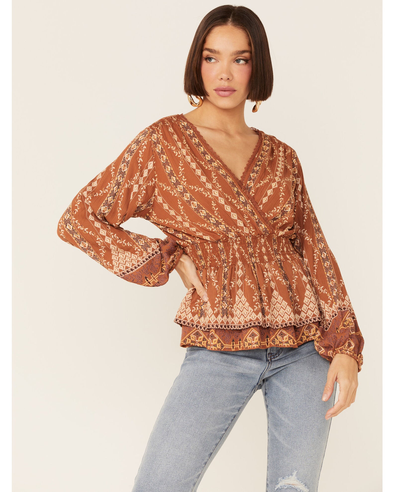 Product Name: Angie Women's Rust Border Print Surplice Peplum Woven Top